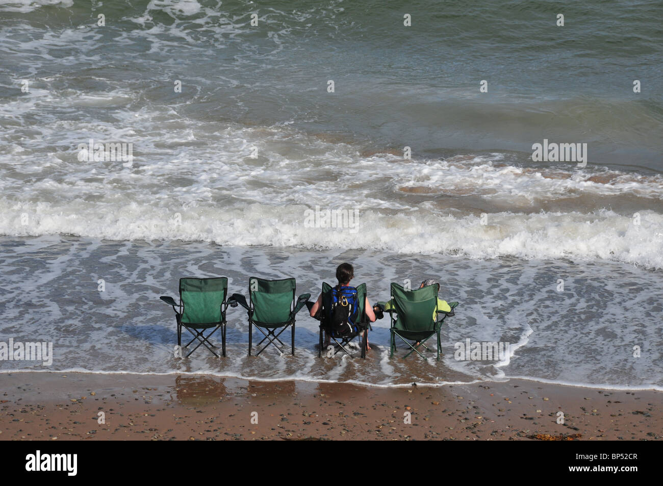 People resting on a beach Stock Photo - Alamy