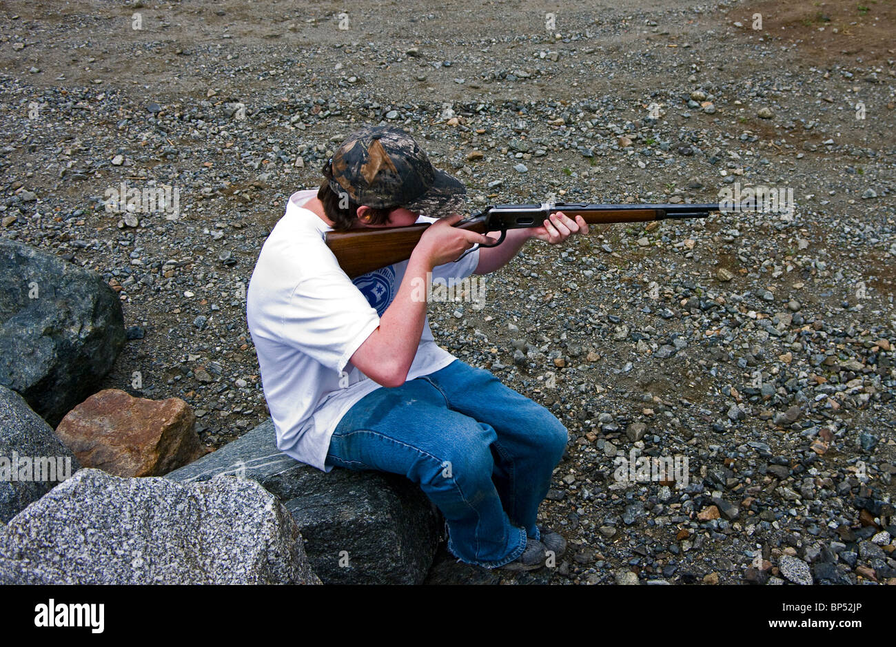 Teenager shotting a 30-30 rifle Stock Photo - Alamy