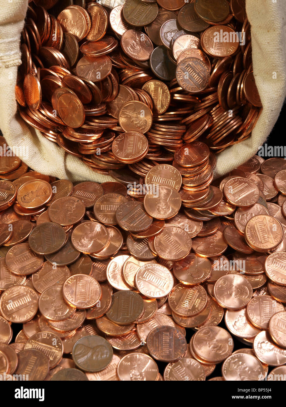 New pennies spilling out of a vintage canvas coin bag Stock Photo - Alamy