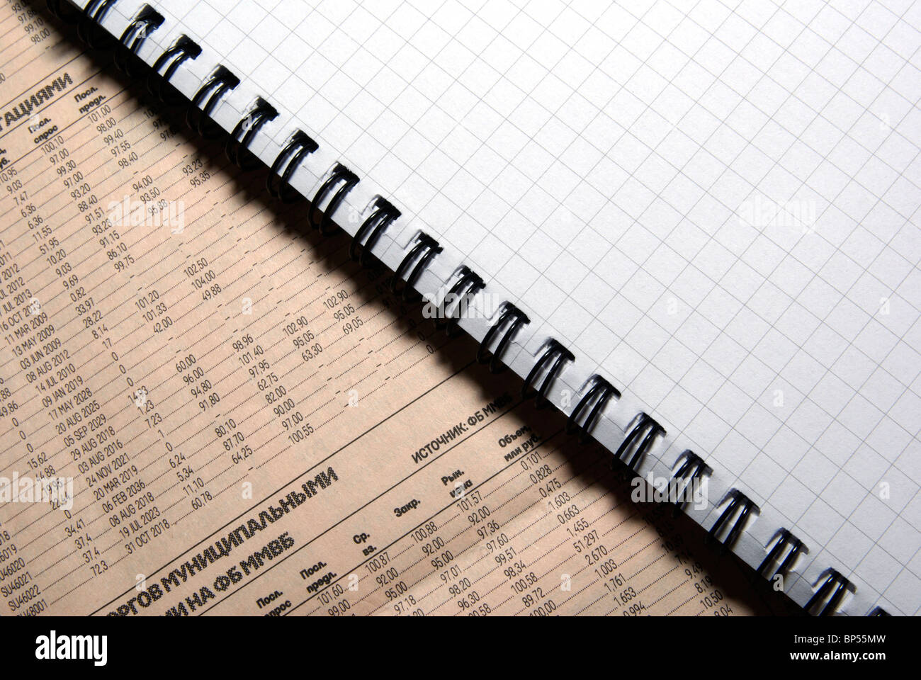 Business newspaper and notebook Stock Photo - Alamy