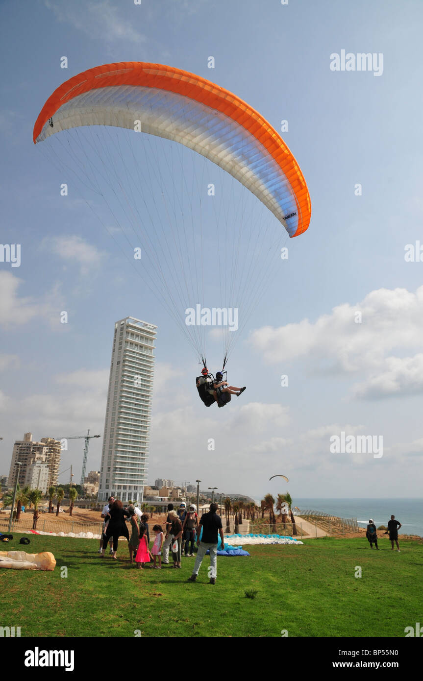 Israel, Sharon region, Netanya, Paragliding off the cliff of the ...