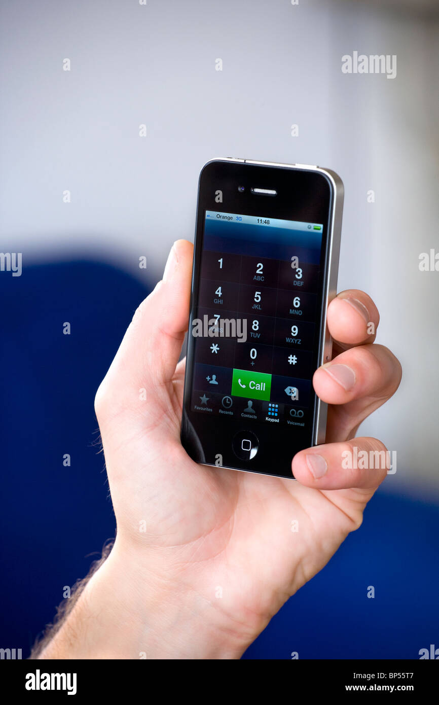 Man holding iphone 4 hi-res stock photography and images - Alamy