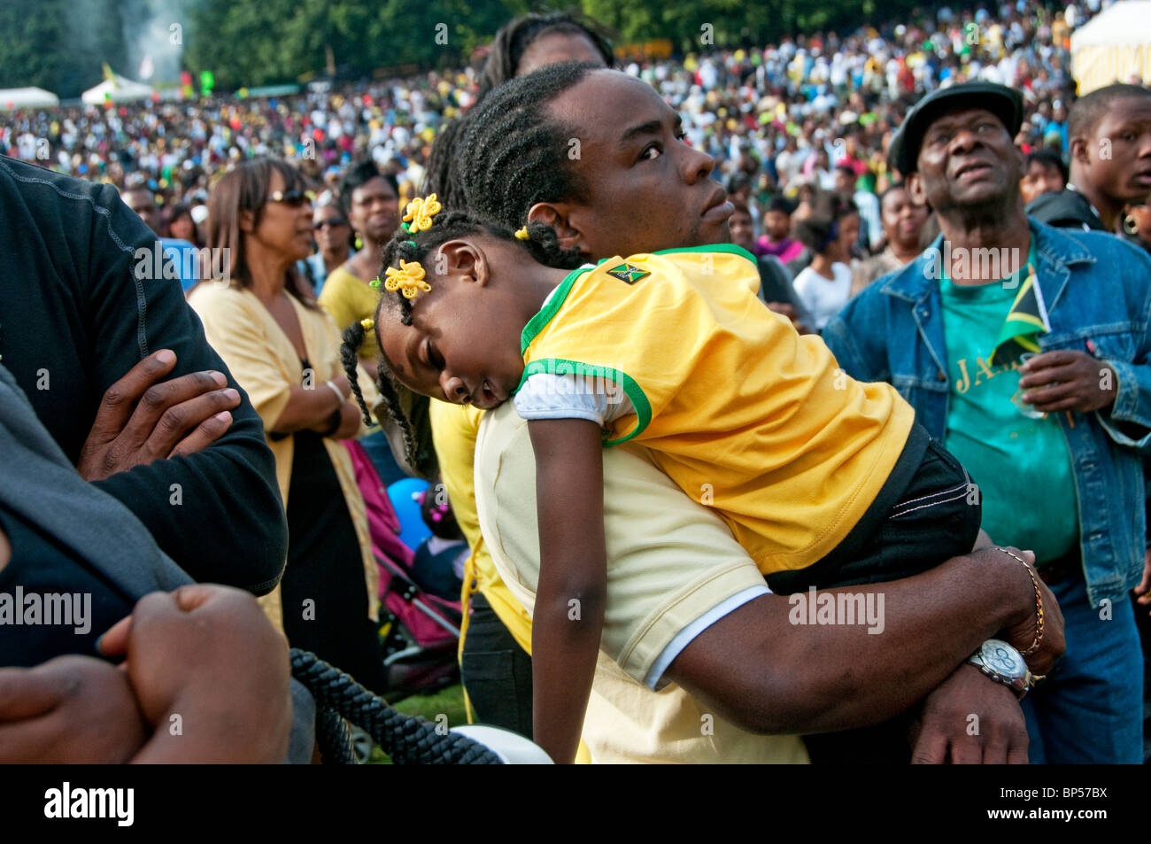 Father holding sleeping child at West Indian Jamaican family day at ...