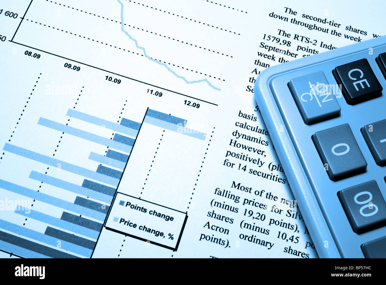 Calculator and printed financial report Stock Photo - Alamy