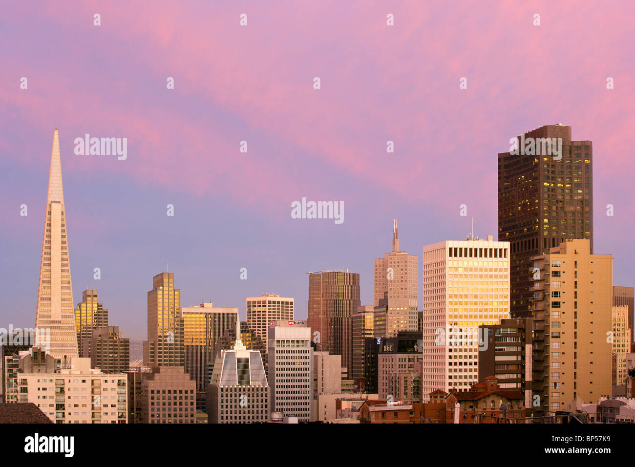 San Francisco sunset skyline and Bay Bridge in California with ...