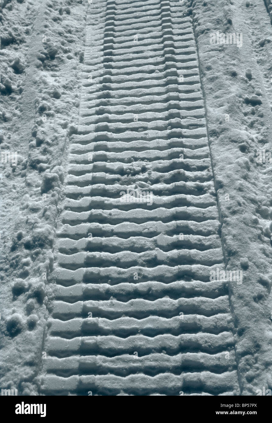 snowmobile tracks in the snow Stock Photo - Alamy