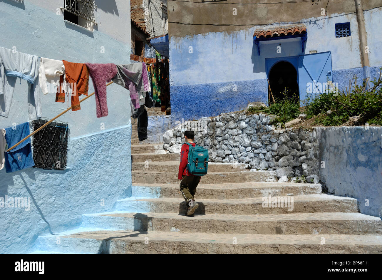 Moroccan Schoolboy Climbing Steps, Stairs or Stairway in the Old Town ...