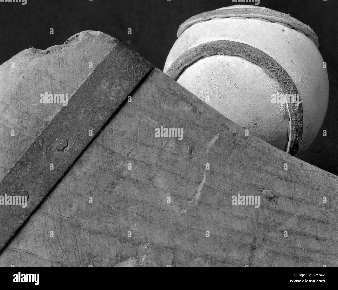 Hurley handle and ball - detailed shot on texture dark grey background ...