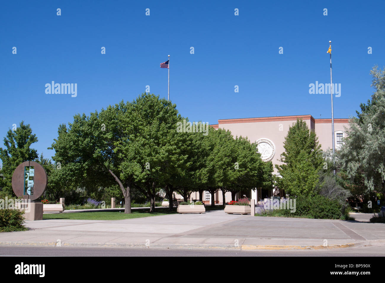 Tree-lined front entrance to the Roundhouse, New Mexico state capitol ...