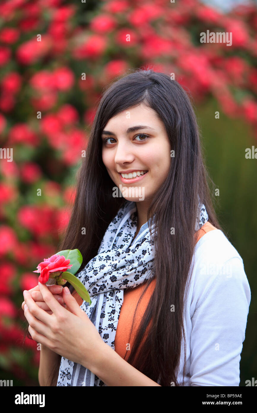 Portland, Oregon, United States Of America; A Teenage Girl Holding A ...