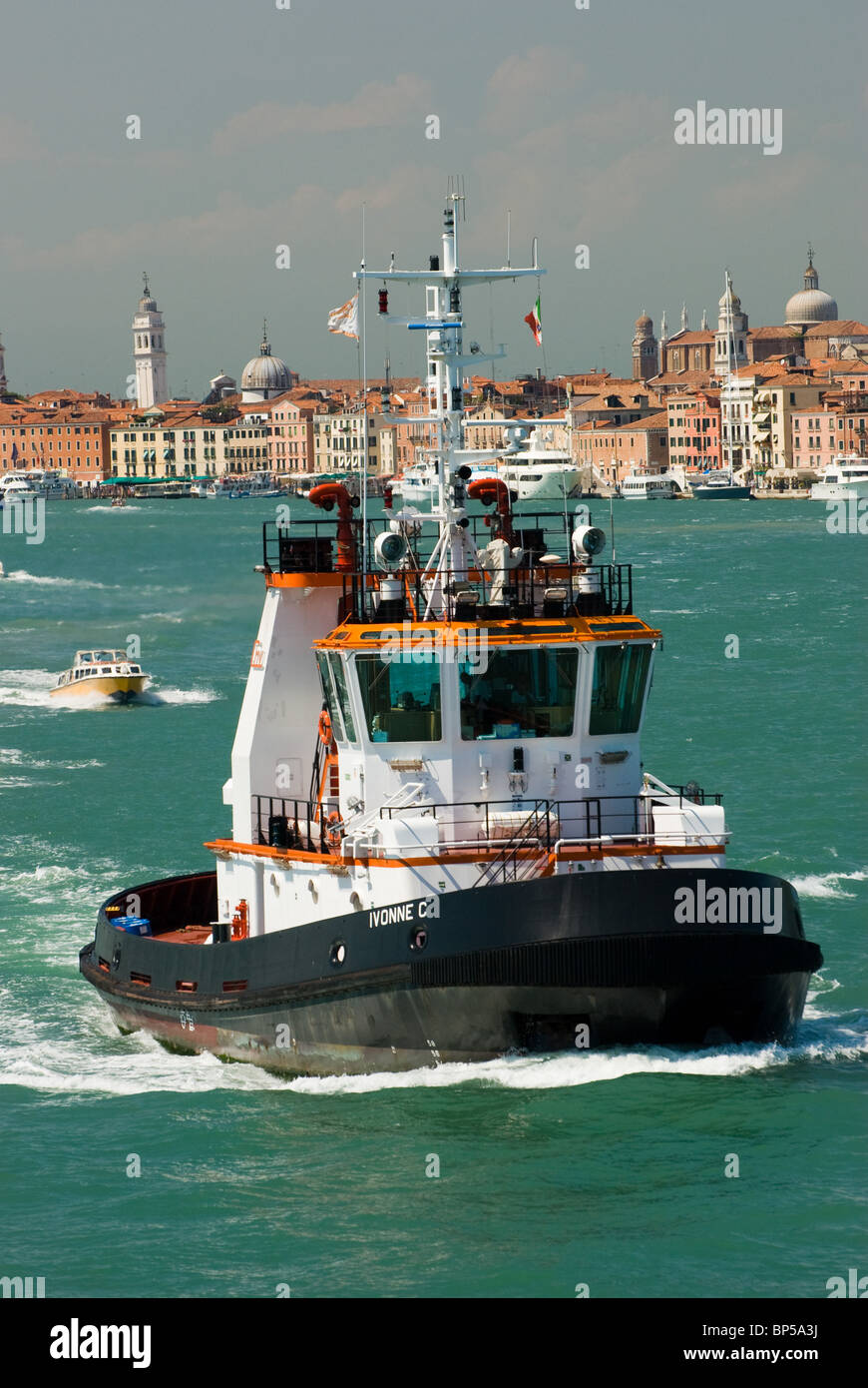Tug boat on Canale della Giudecca, the approach to Venice, Italy near ...