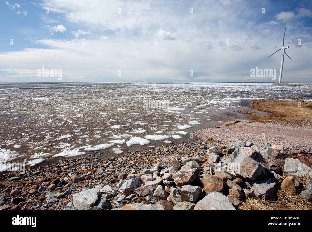 Last pieces of sea ice at at Spring and large wind turbine , Finland ...