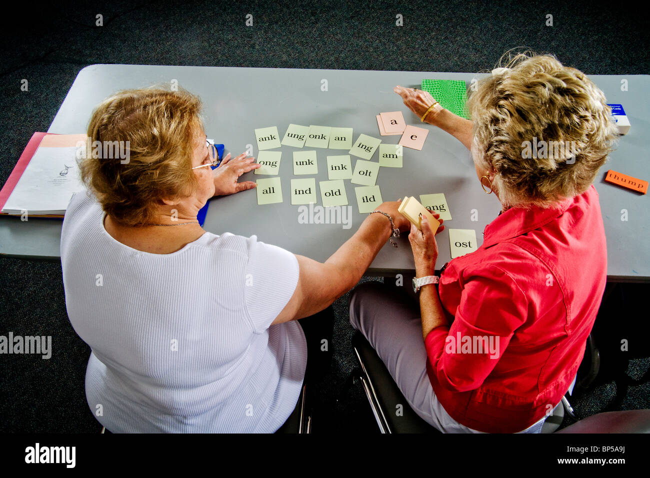 Using "word card" components to form a complete word, a volunteer adult ...