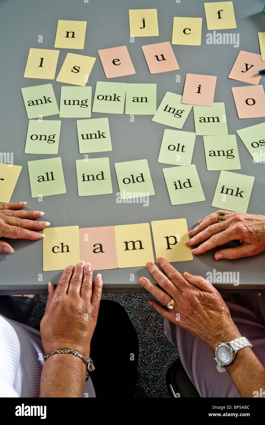 Using "word card" components to form a complete word, a volunteer adult ...