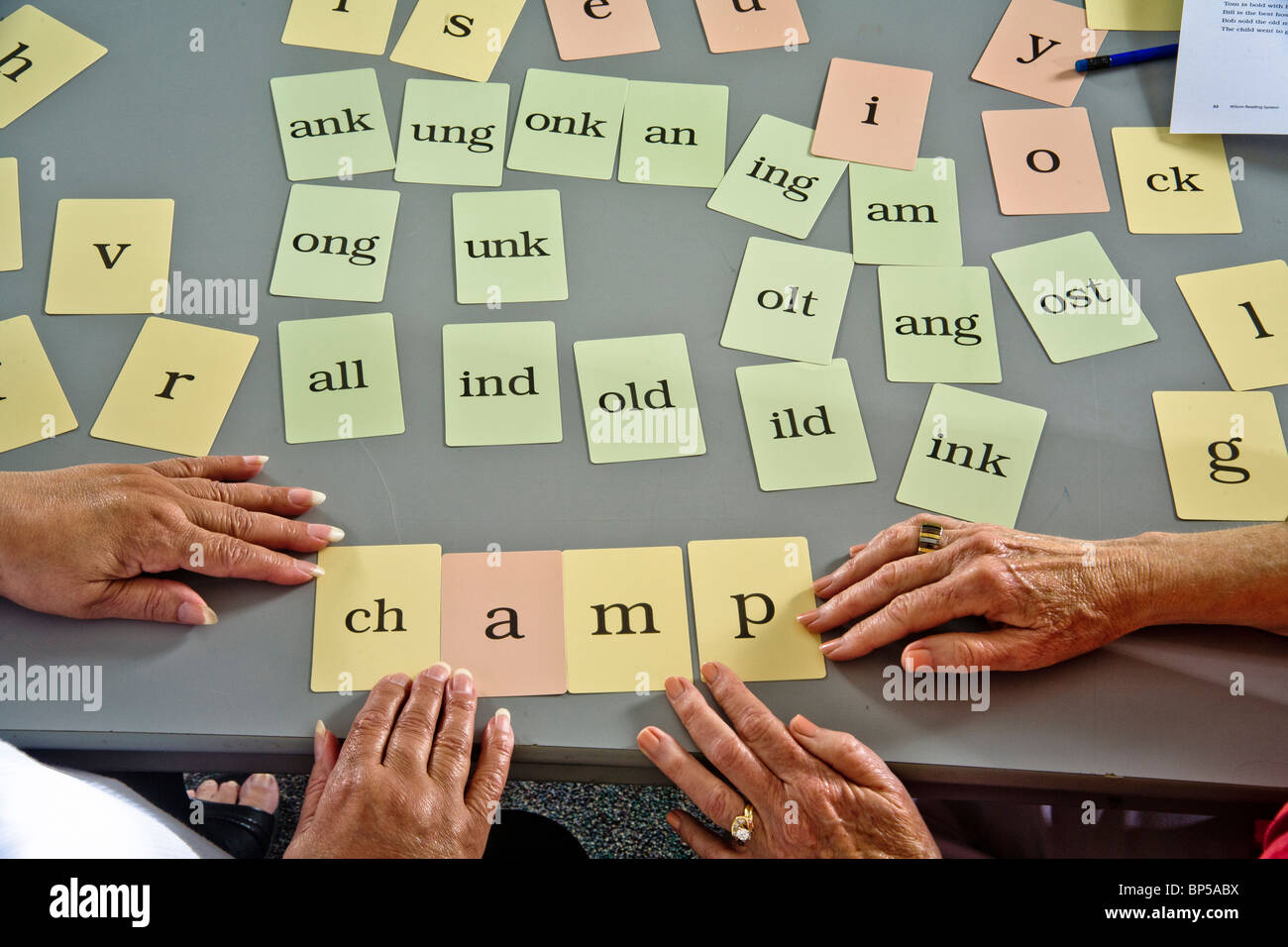 Using "word card" components to form a complete word, a volunteer adult ...