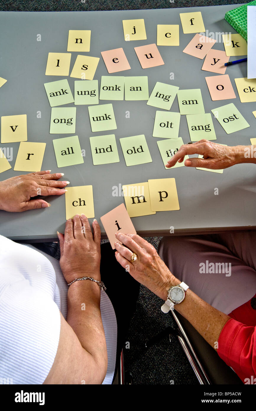 Using "word card" components to form a complete word, a volunteer adult ...