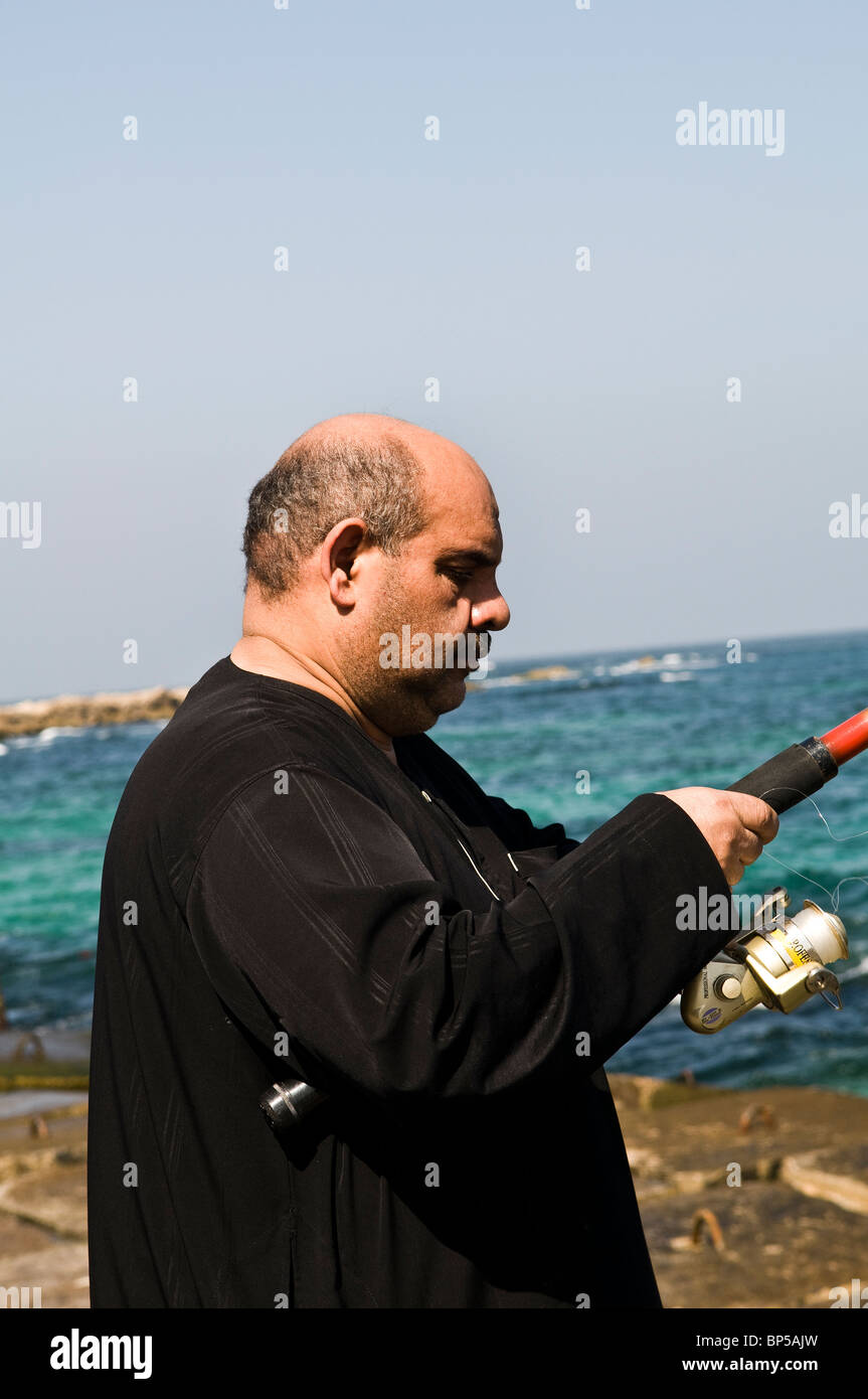 A fisherman trying to catch fish Stock Photo - Alamy