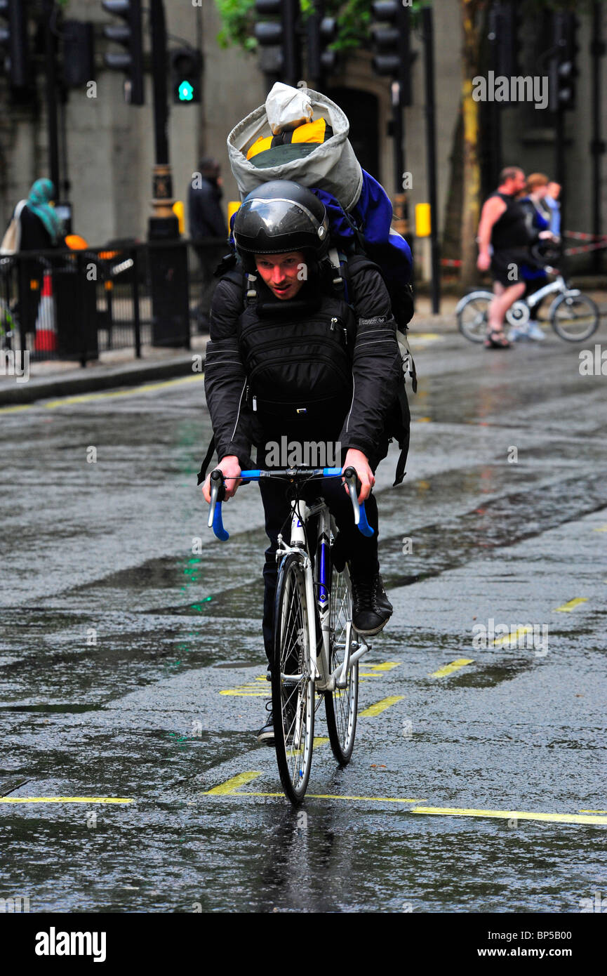 Cycling in the rain, London Stock Photo - Alamy