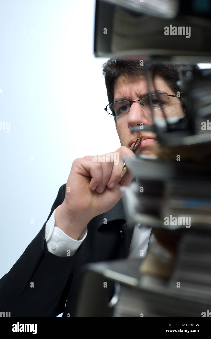 Overworked man pile of papers hi-res stock photography and images - Alamy