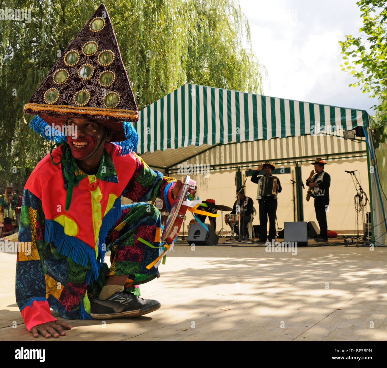A male Brazilian dancer on stage with a band behind at the 53rd ...