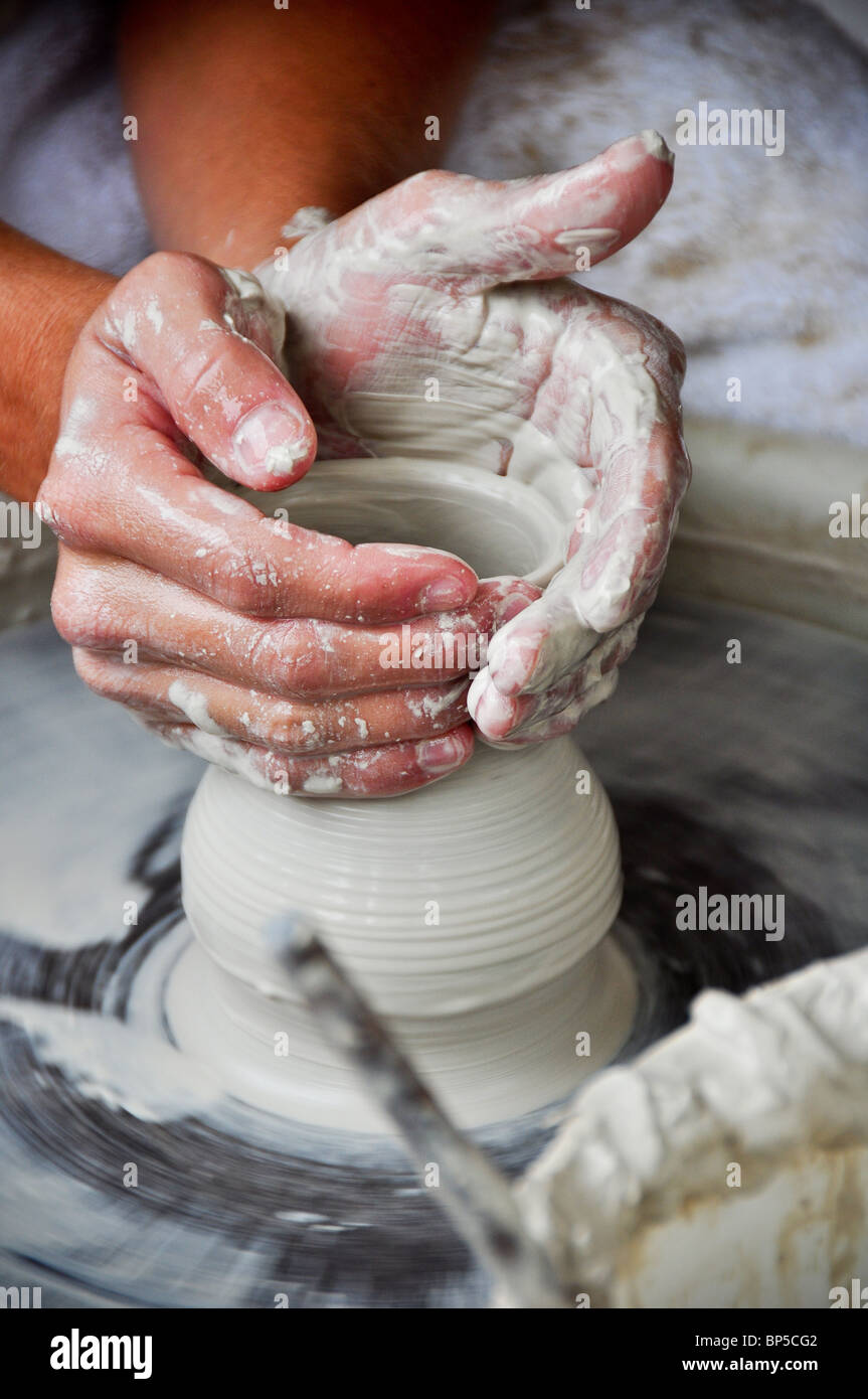 artist throwing clay pottery on a ceramics wheel Stock Photo - Alamy