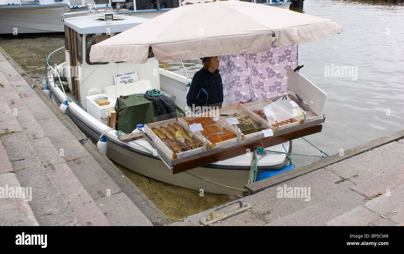 Fresh fish being sold from a small boat in Kauppatori quayside market ...