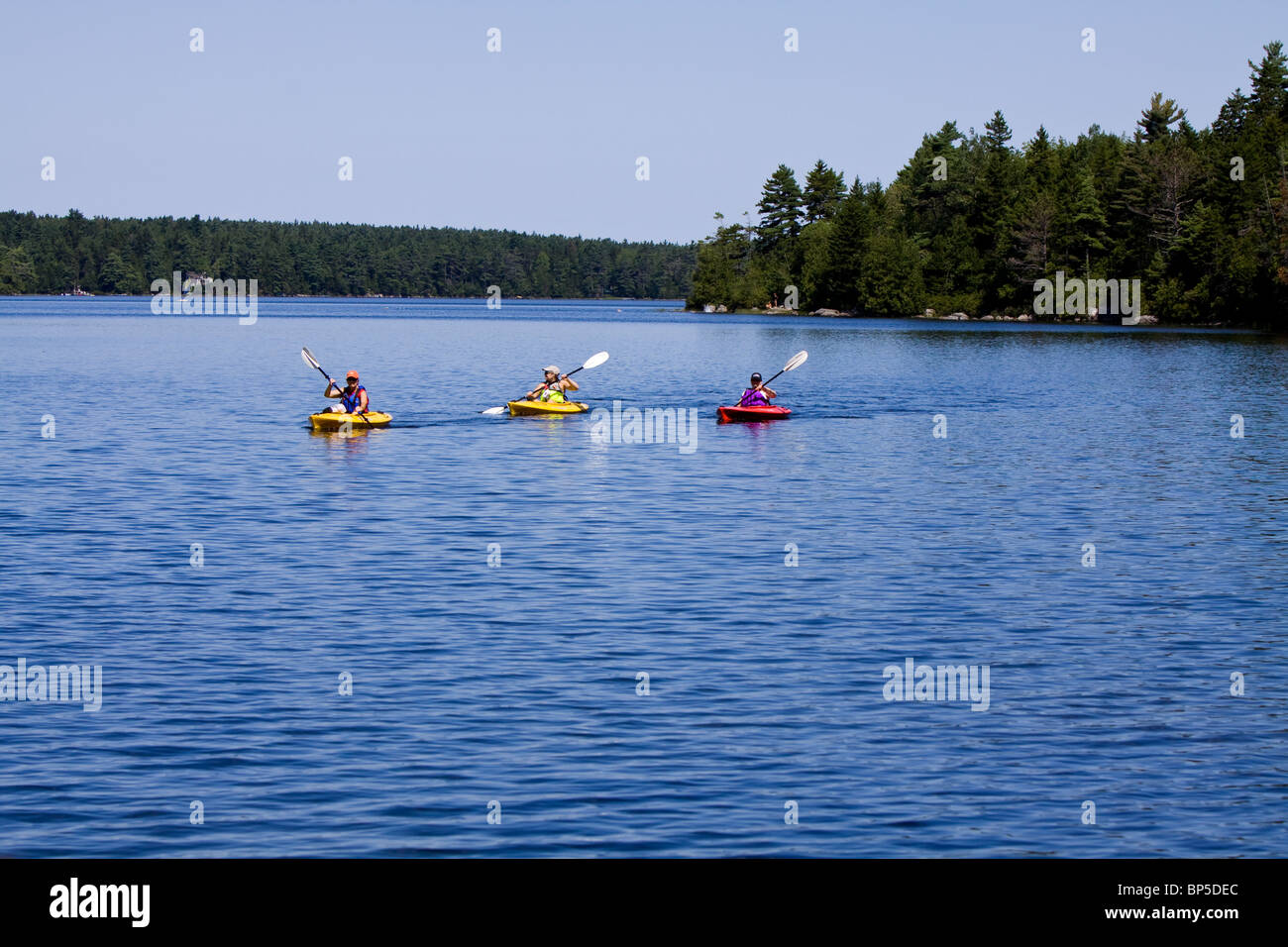 Three women on kayaks in Acadia National Park,Echo lake Stock Photo - Alamy