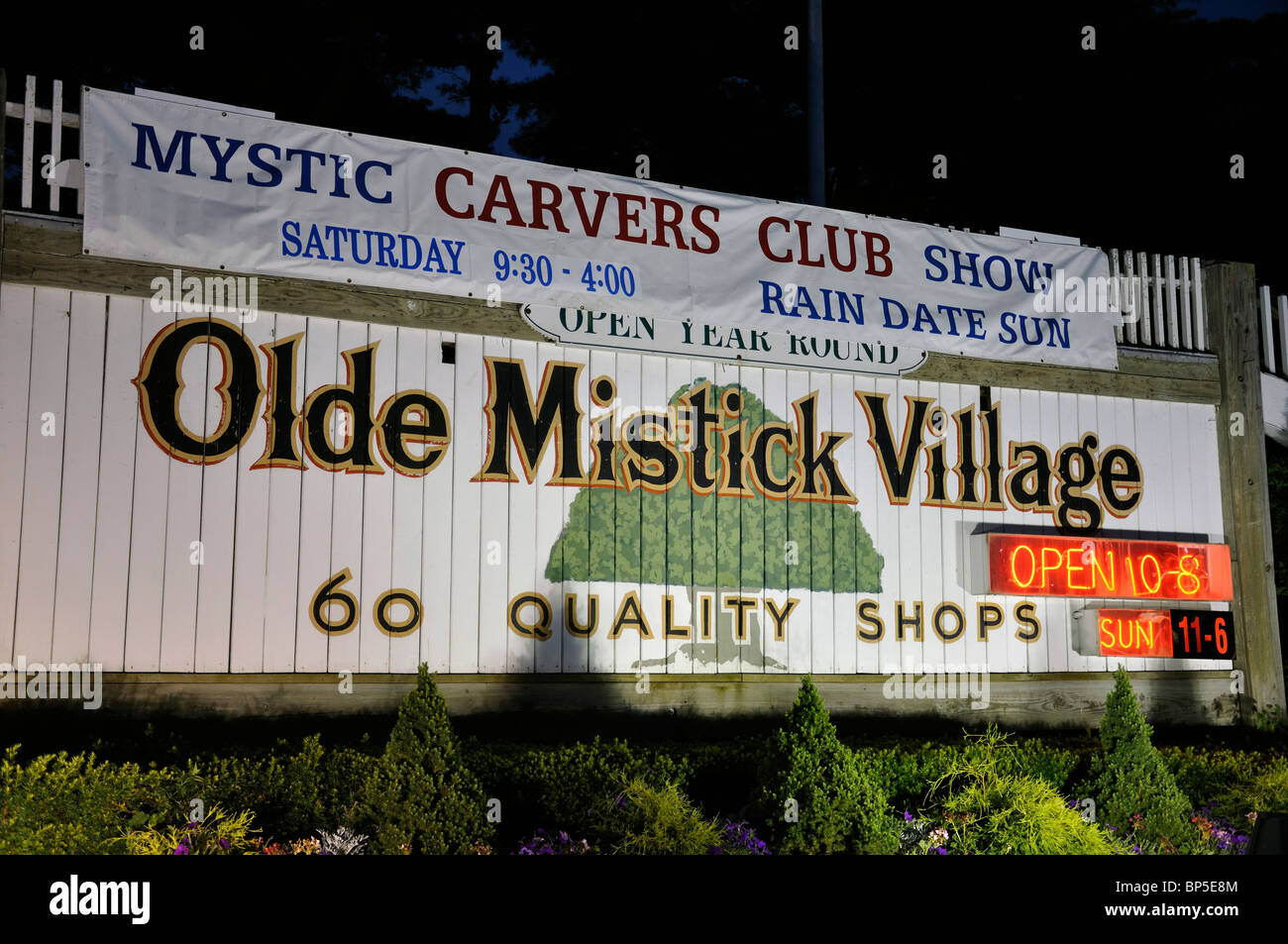 Sign of Mystic Village at night, Connecticut, USA Stock Photo - Alamy