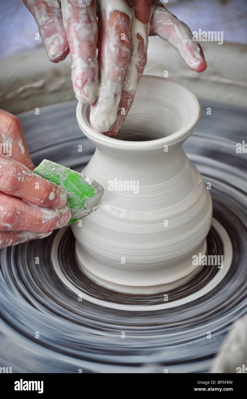 artist throwing a clay pottery on a ceramics wheel Stock Photo - Alamy