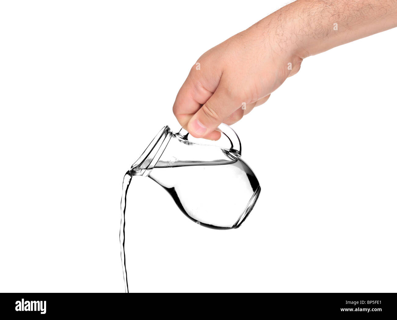 Hand pouring water from pitcher Stock Photo - Alamy