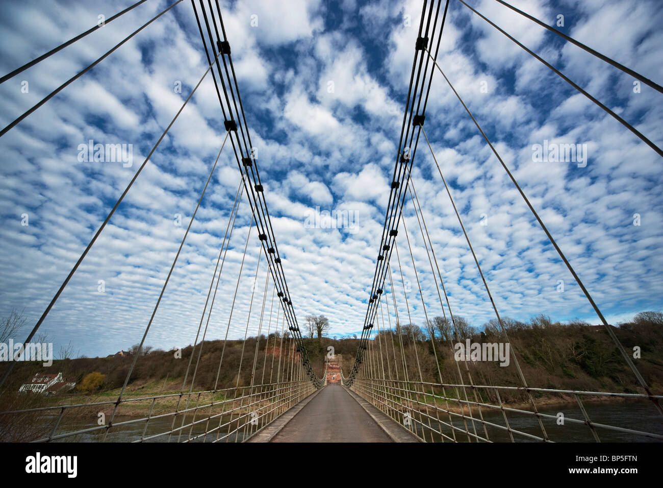 Northumberland, England; A Bridge With Tall Metal Supports On Either ...