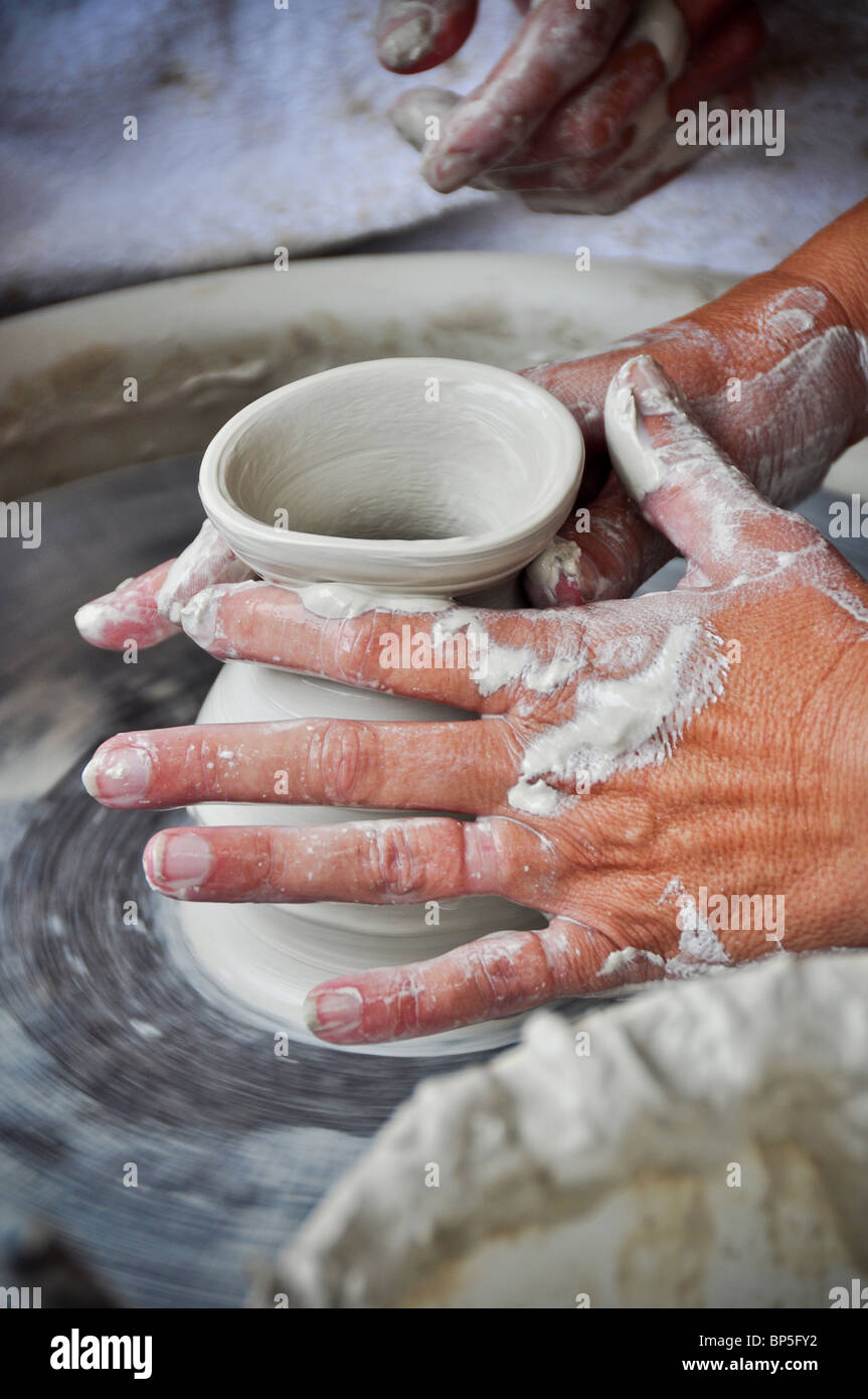 artist throwing pottery on a ceramics wheel Stock Photo - Alamy