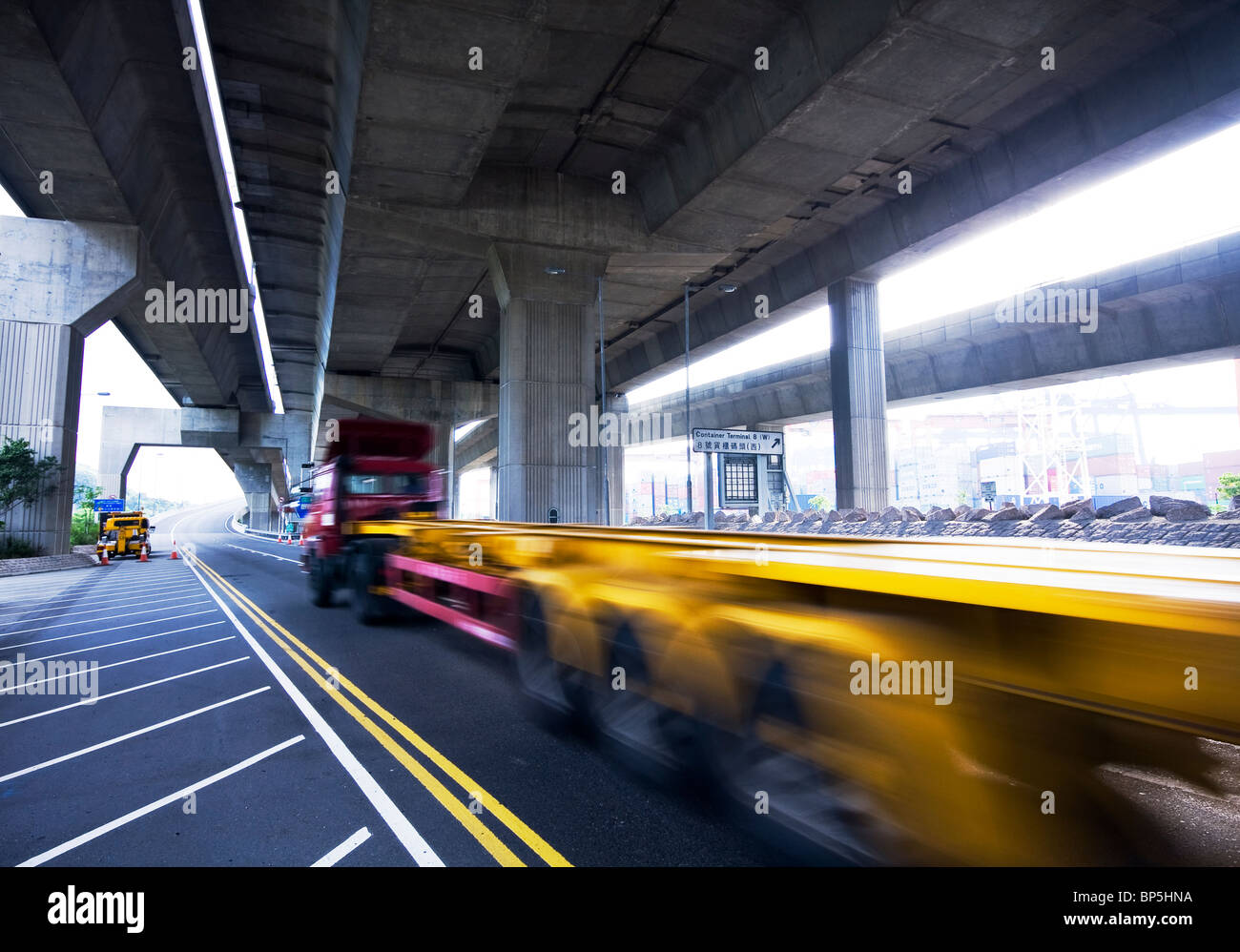 container car fast moving under the freeway bridge Stock Photo - Alamy