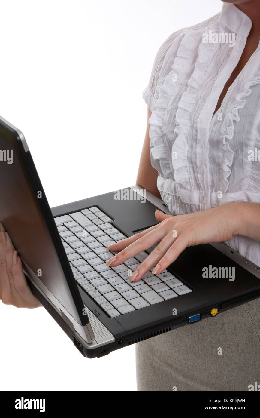 Crop Of Woman holding laptop and Typing Stock Photo - Alamy