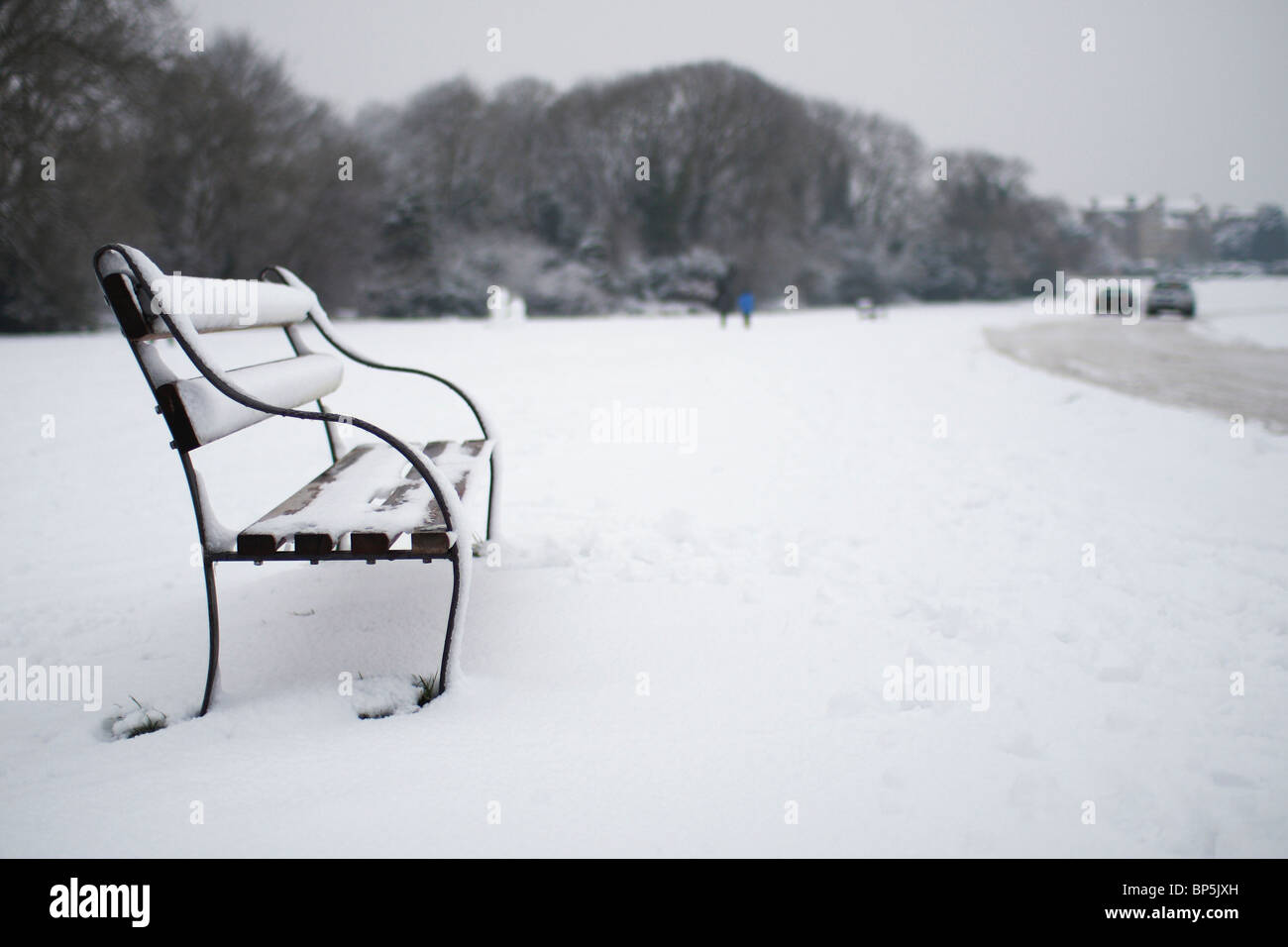 Empty Bench covered in snow Stock Photo - Alamy