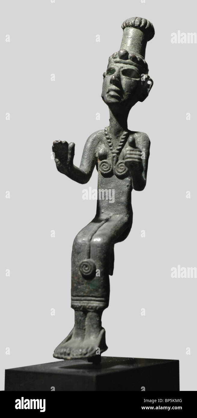 5321. Bronze figurine of a seated female deity, perhaps Cnaanite. Syria ...