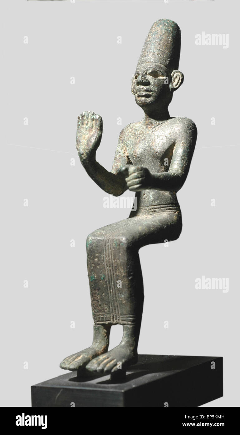 5321. Bronze figurine of a seated female deity, perhaps Cnaanite. Syria ...