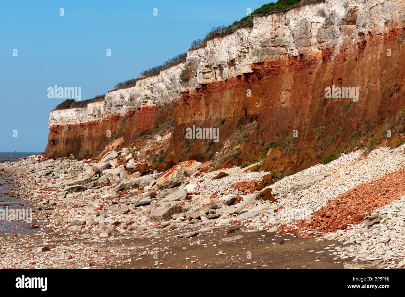 The red and white banded cliffs of Hunstanton on the Norfolk coast ...