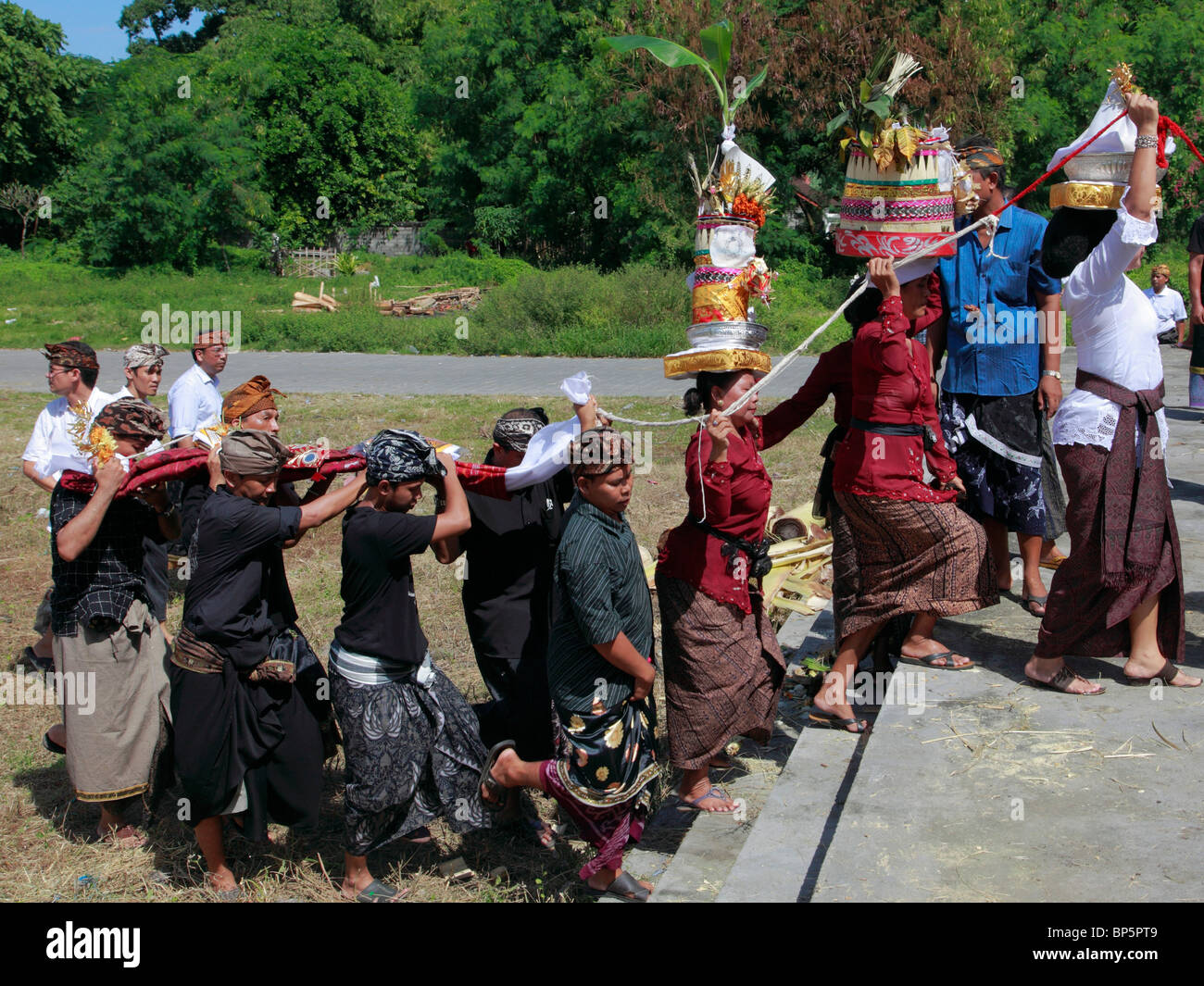 Indonesia, Bali, cremation ceremony, people carrying ceremonial ...