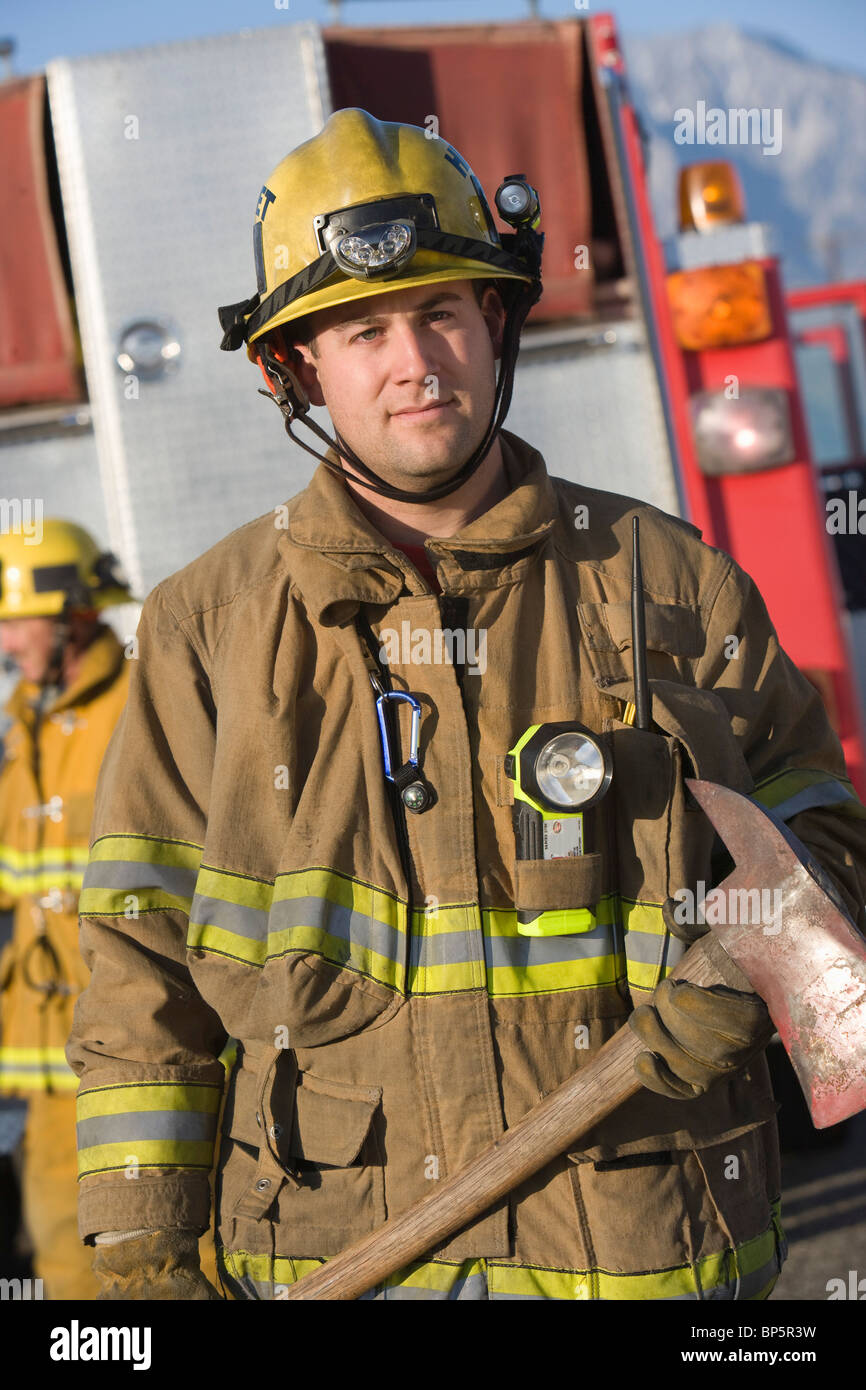 Firefighter with vehicle Stock Photo - Alamy