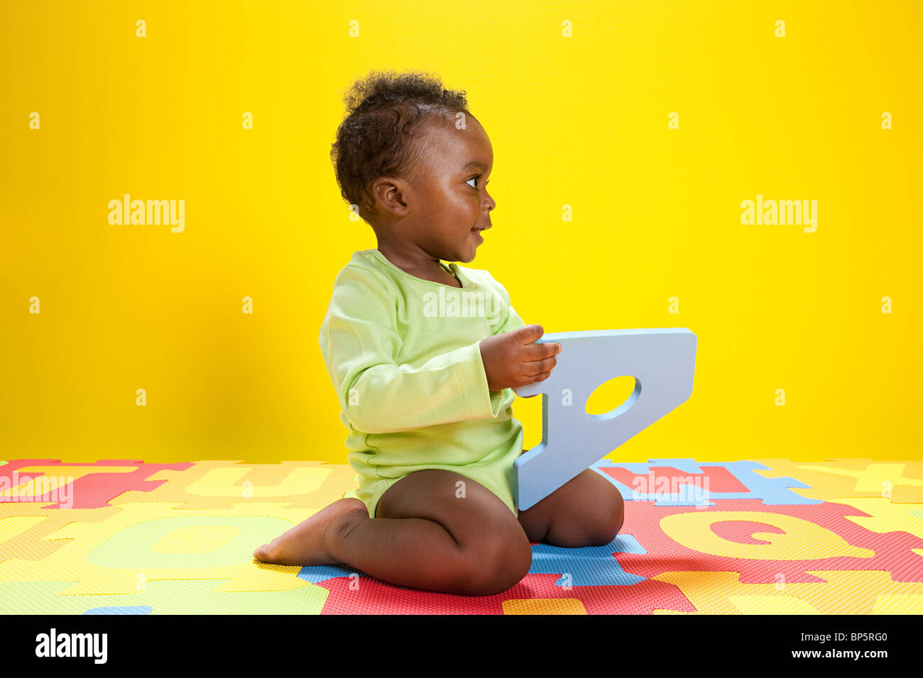 Children holding alphabet letters hi-res stock photography and images ...