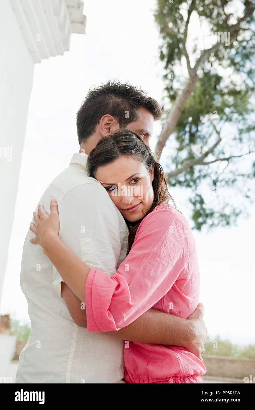 Young romantic couple embracing Stock Photo - Alamy