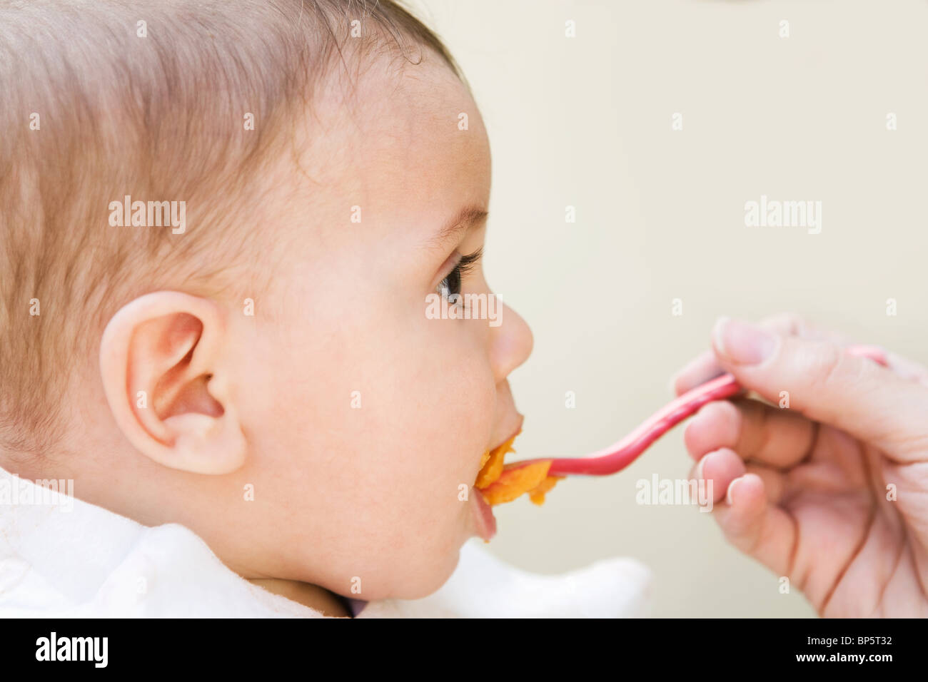 Baby boy being fed Stock Photo - Alamy