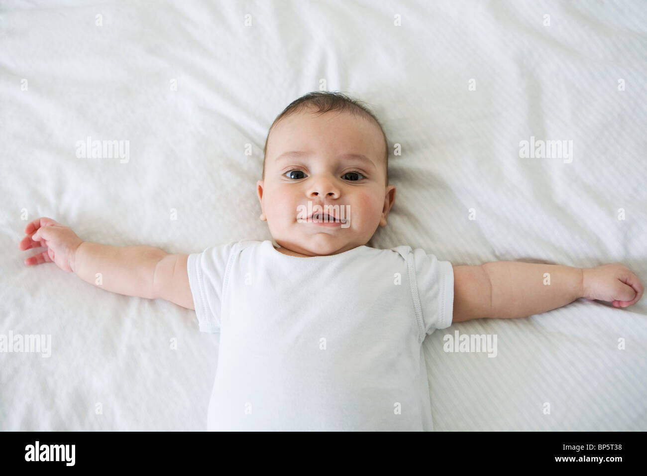 Baby boy lying on back Stock Photo - Alamy