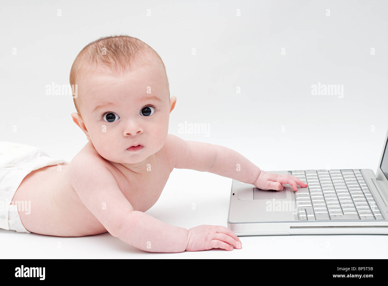Baby with a laptop Stock Photo - Alamy