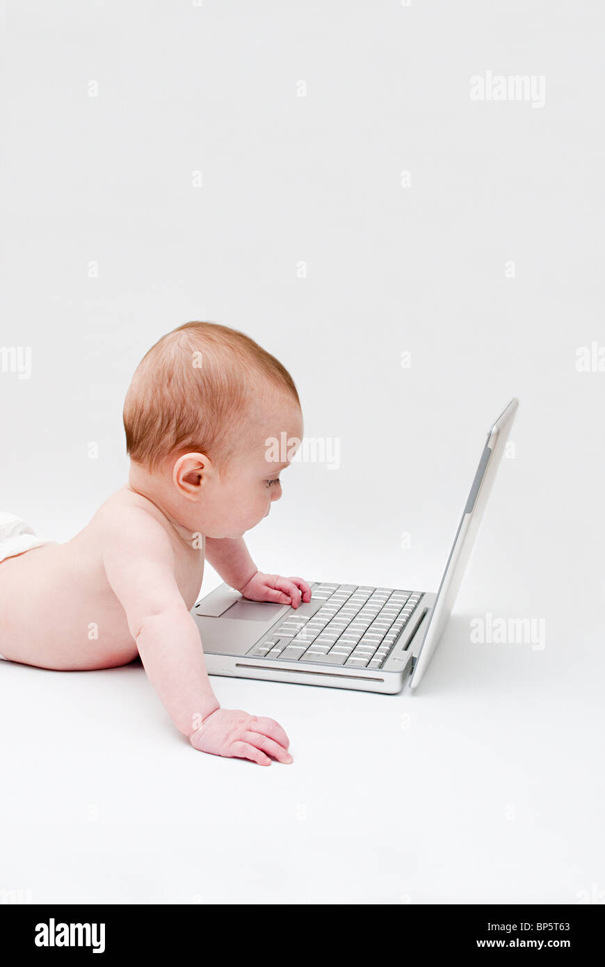 Baby with a laptop Stock Photo - Alamy