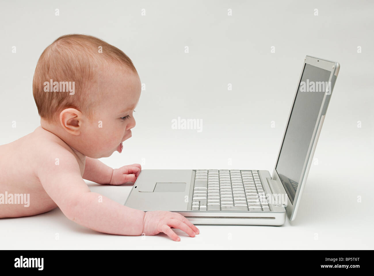 Baby with a laptop Stock Photo - Alamy