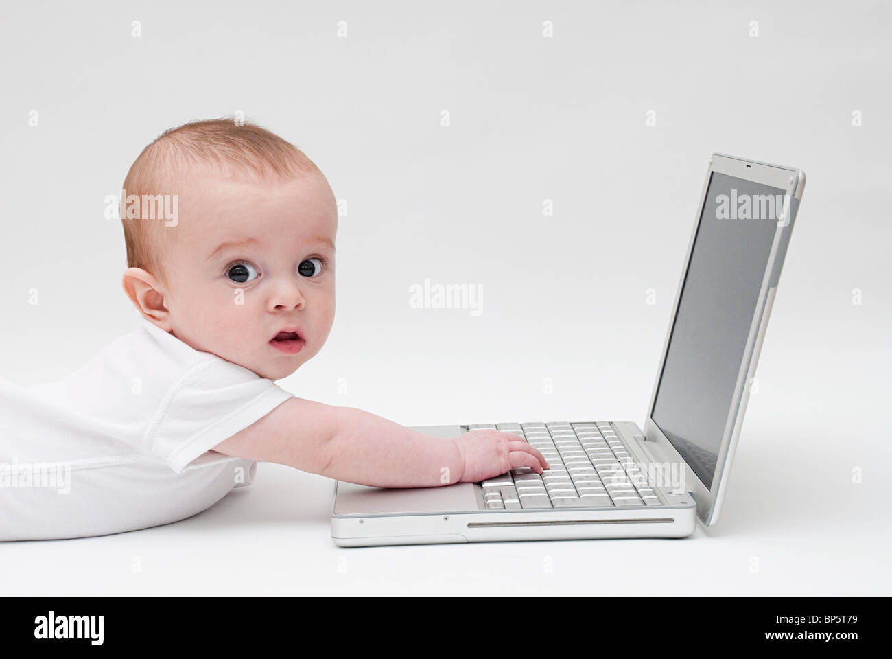 Baby with a laptop Stock Photo - Alamy