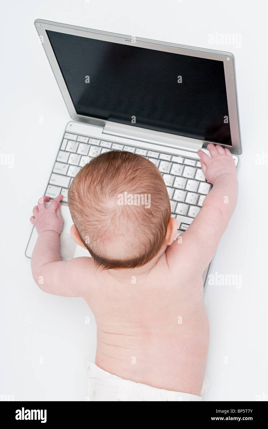 Baby with a laptop Stock Photo - Alamy