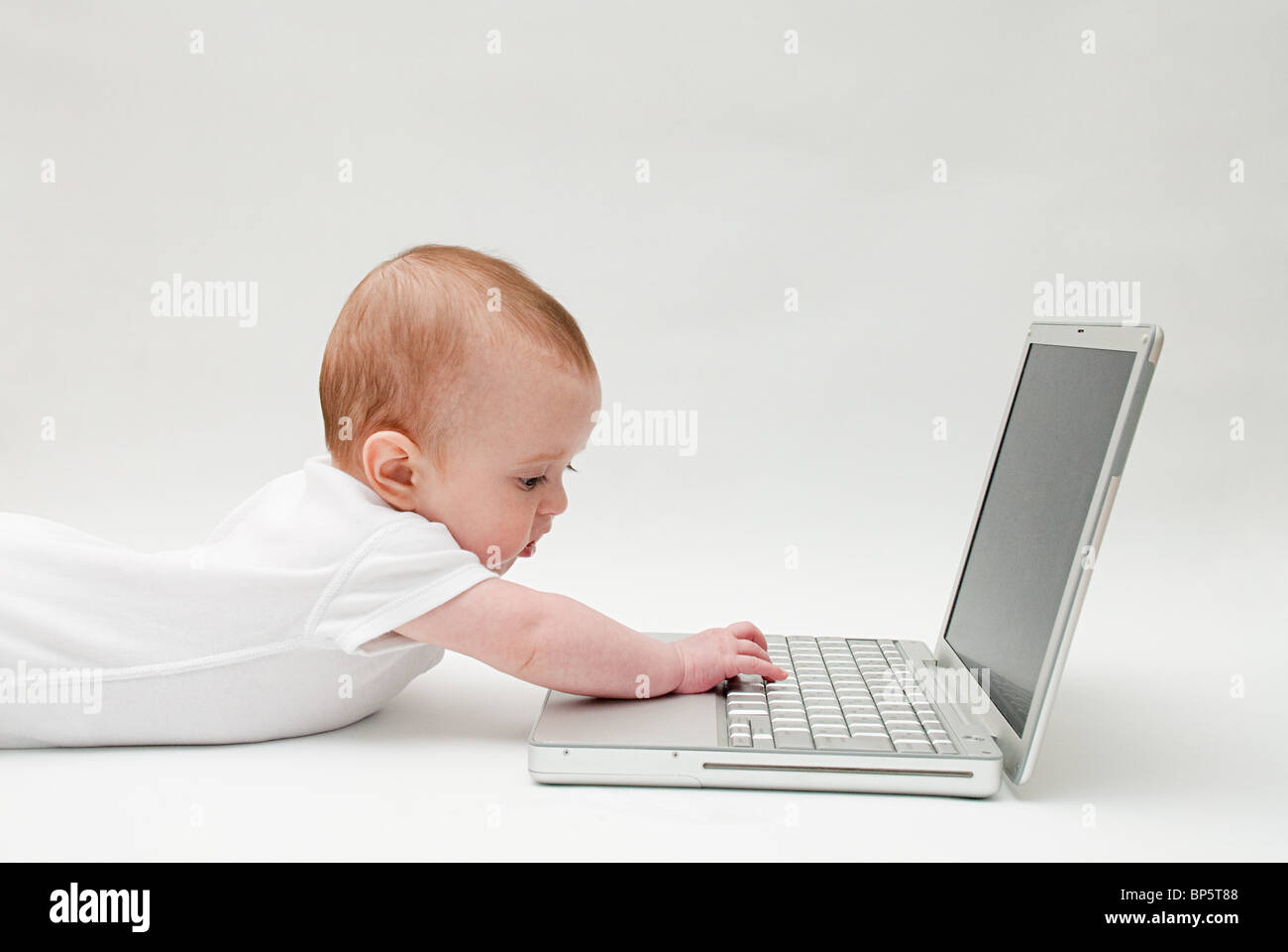 Baby with a laptop Stock Photo - Alamy